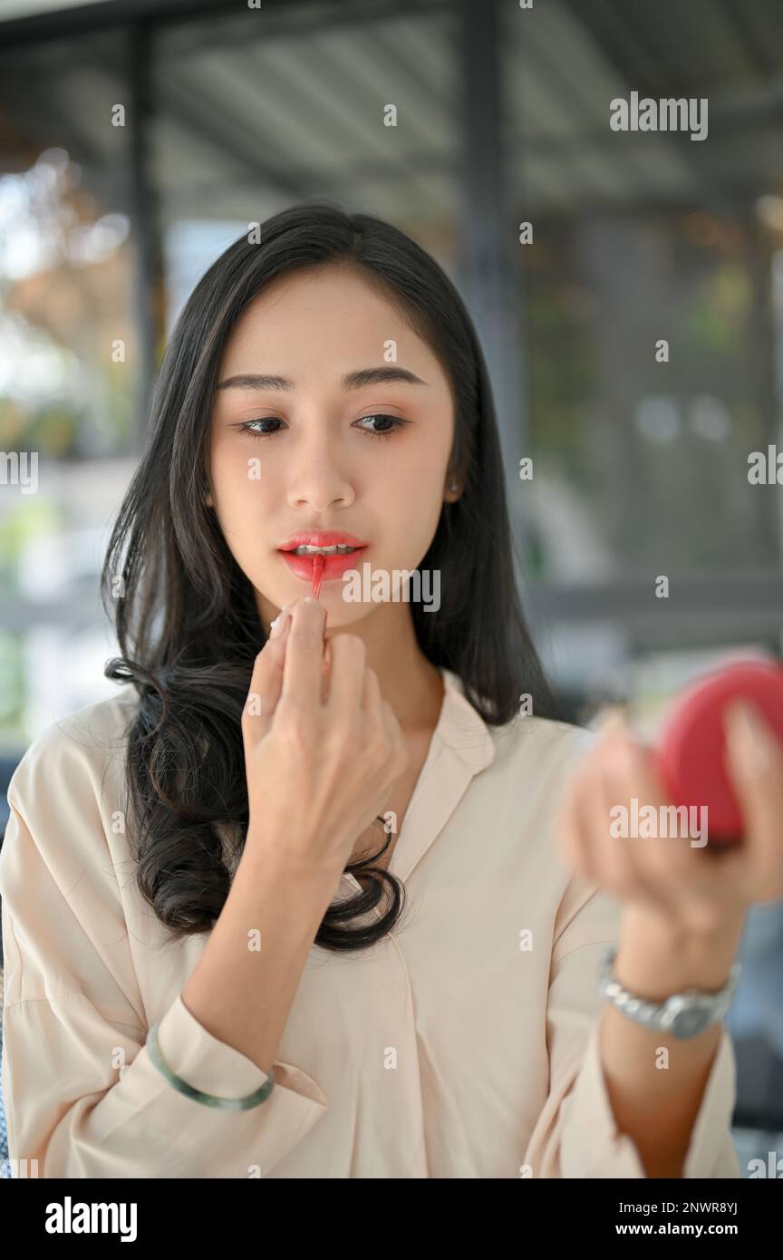 Portrait of a beautiful millennial Asian woman or businesswoman ...