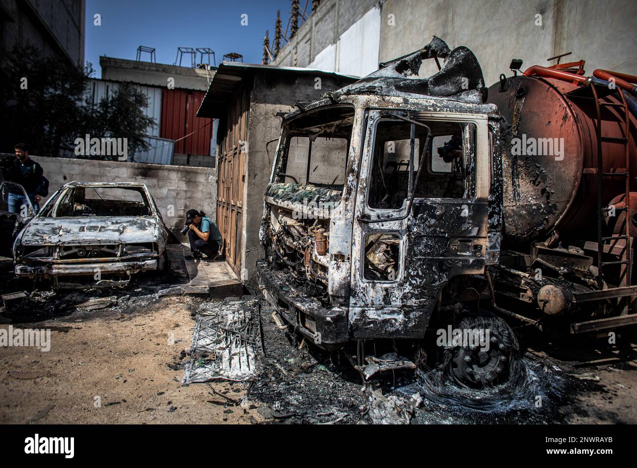 Huwara, Israel. 28th Feb, 2023. A photojournalist takes photos of a ...