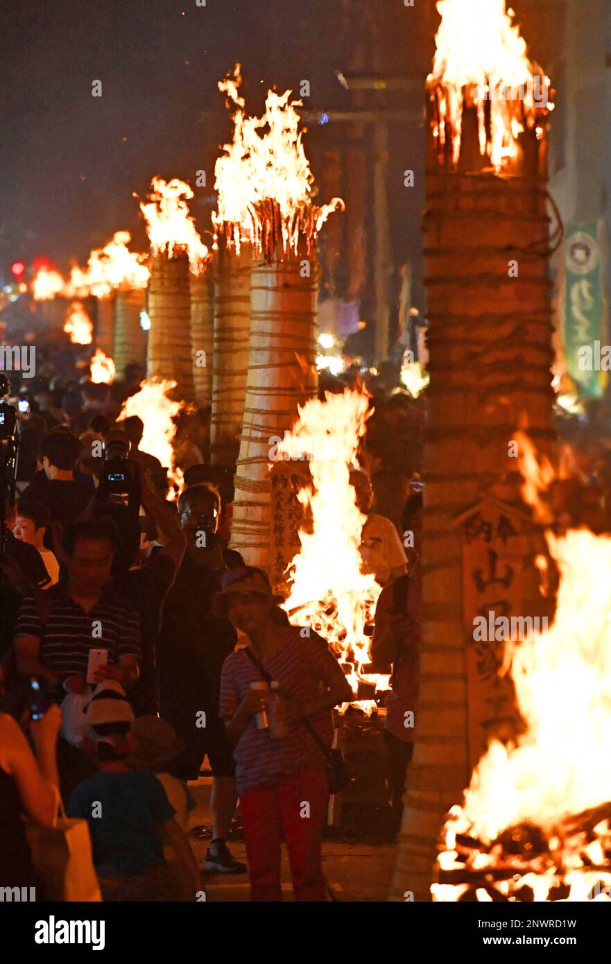 Giant torches, each standing about three meters tall and weighing 200 ...