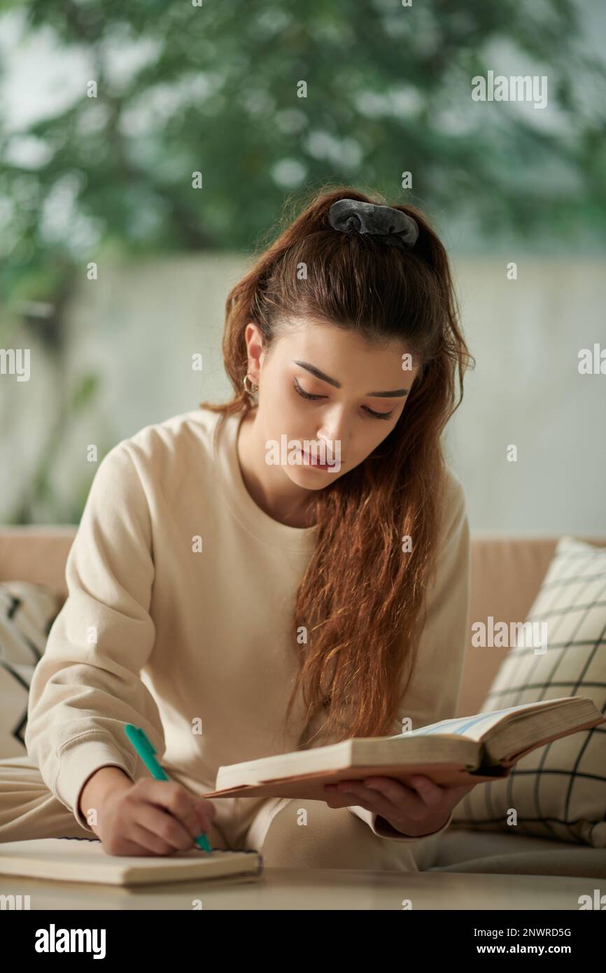 College student doing homework for upcoming class Stock Photo - Alamy