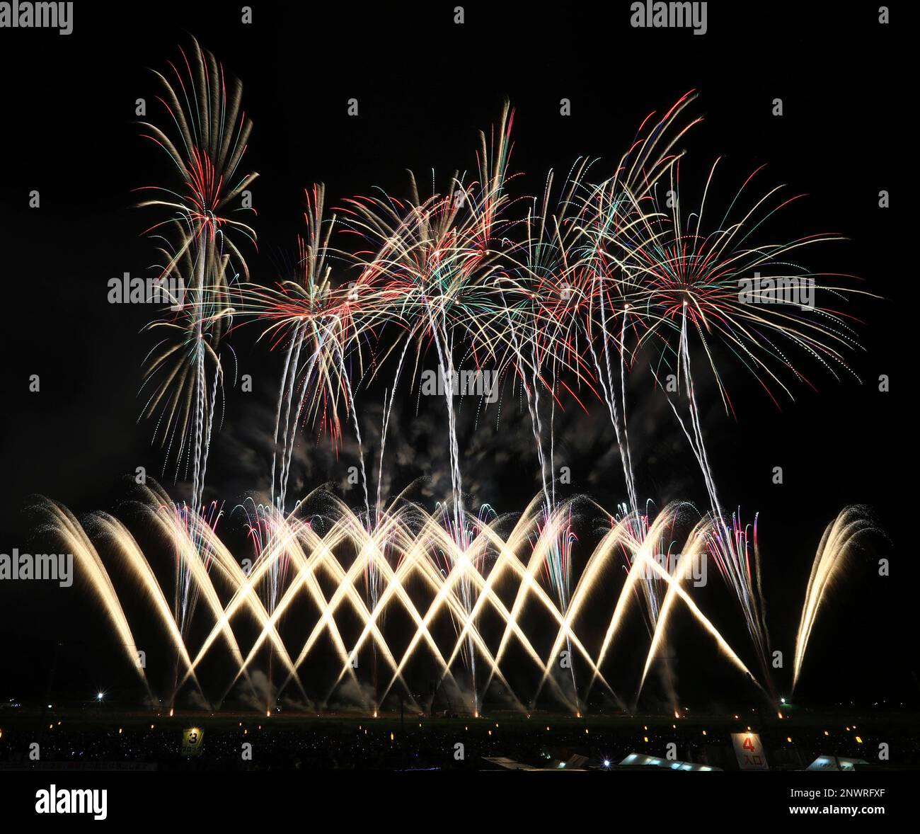 A photo shows fireworks launching in the night sky during the Omagari ...