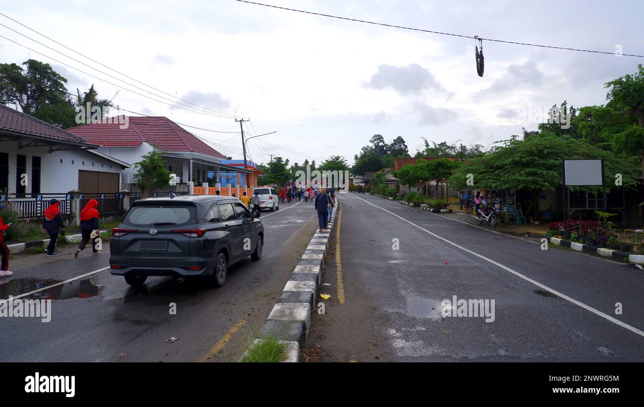 View Of A Two-lane Street In The City Of Muntok At Noon Stock Photo - Alamy