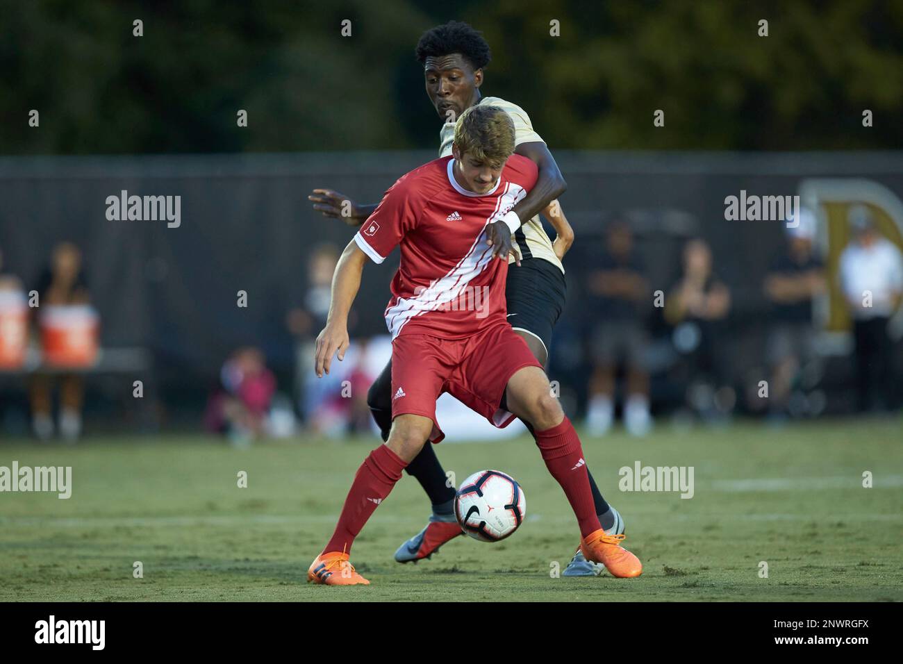 Justin Rennicks (10) of the Indiana Hoosiers uses his body to keep the ...