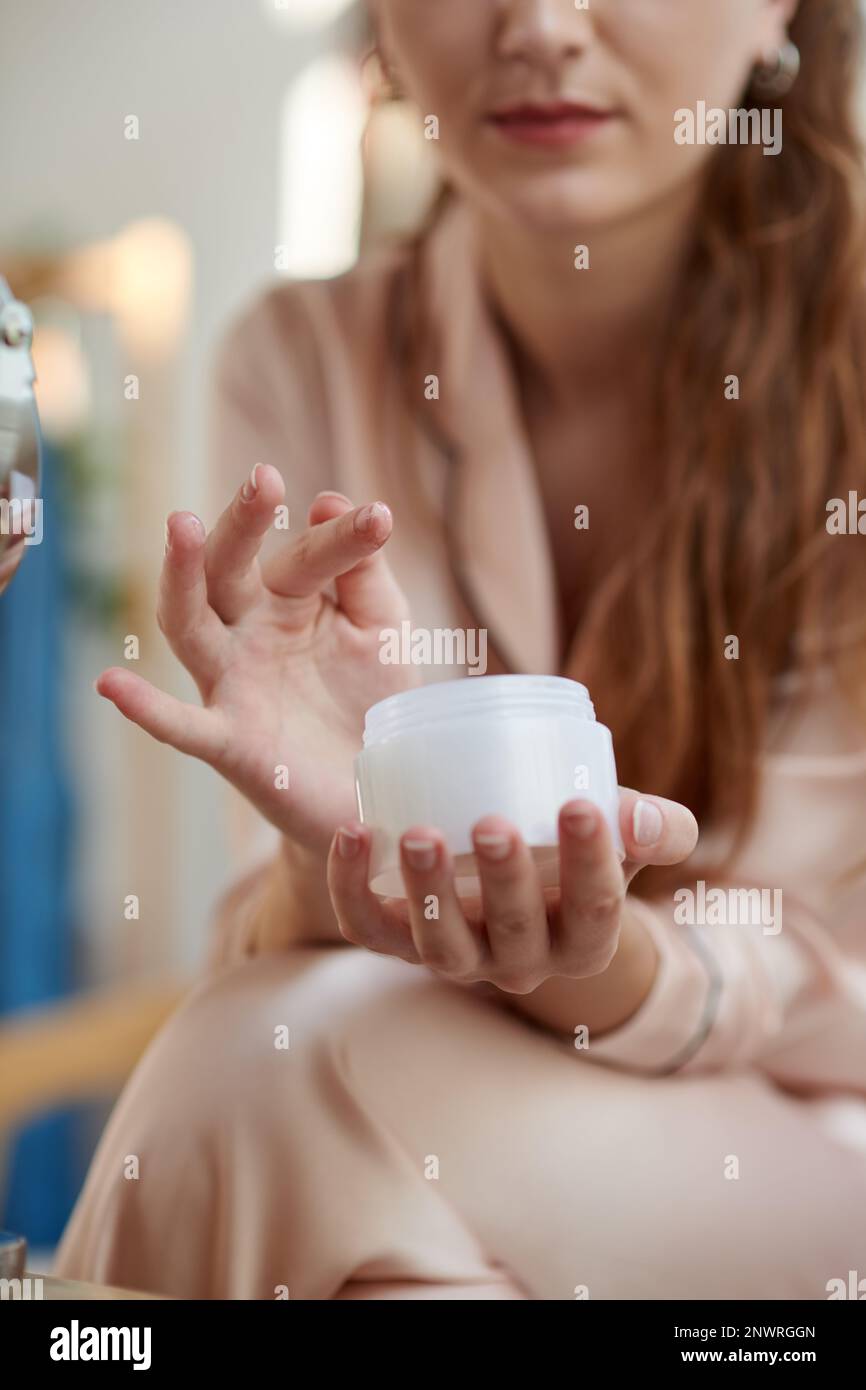Applying sunscreen cropped woman young hi-res stock photography and ...