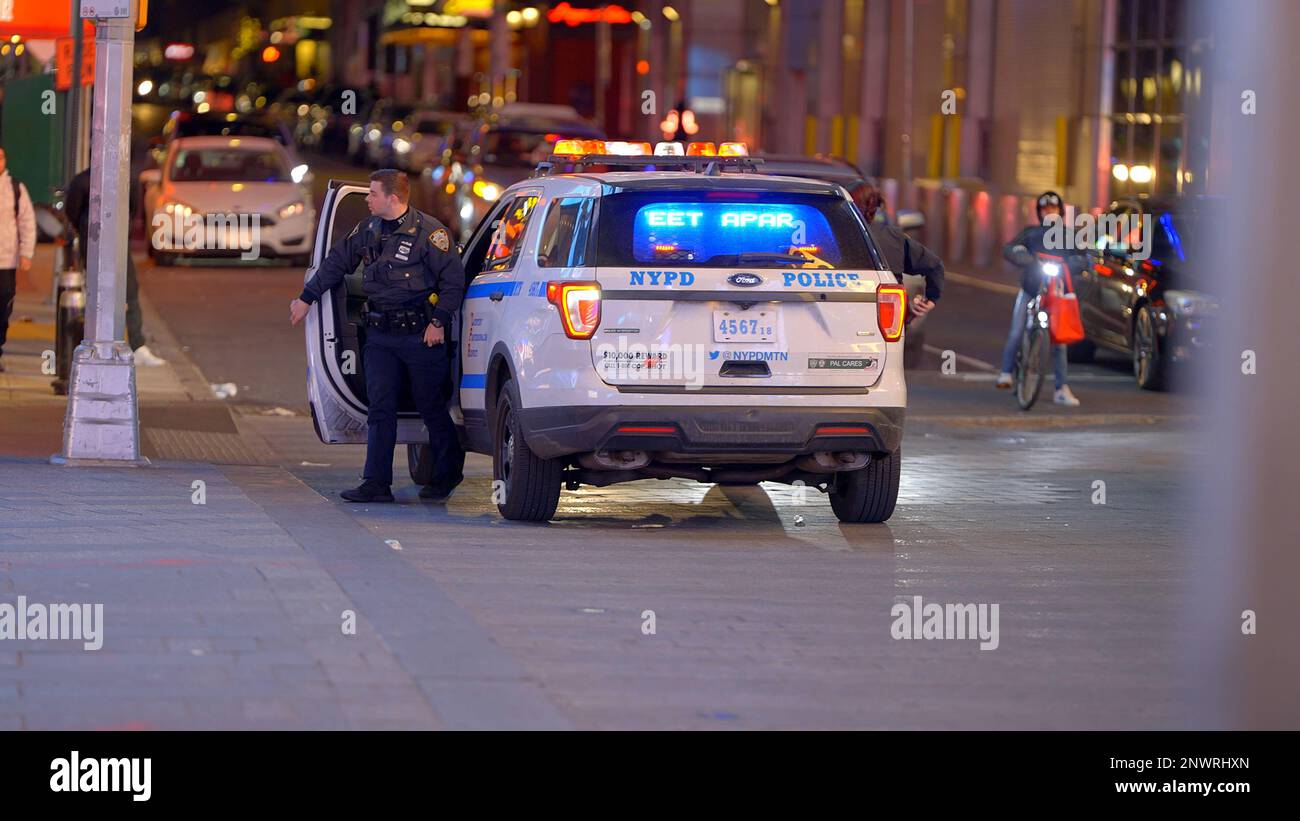 Officers alight from a NYPD Police car in Manhattan - NEW YORK CITY ...