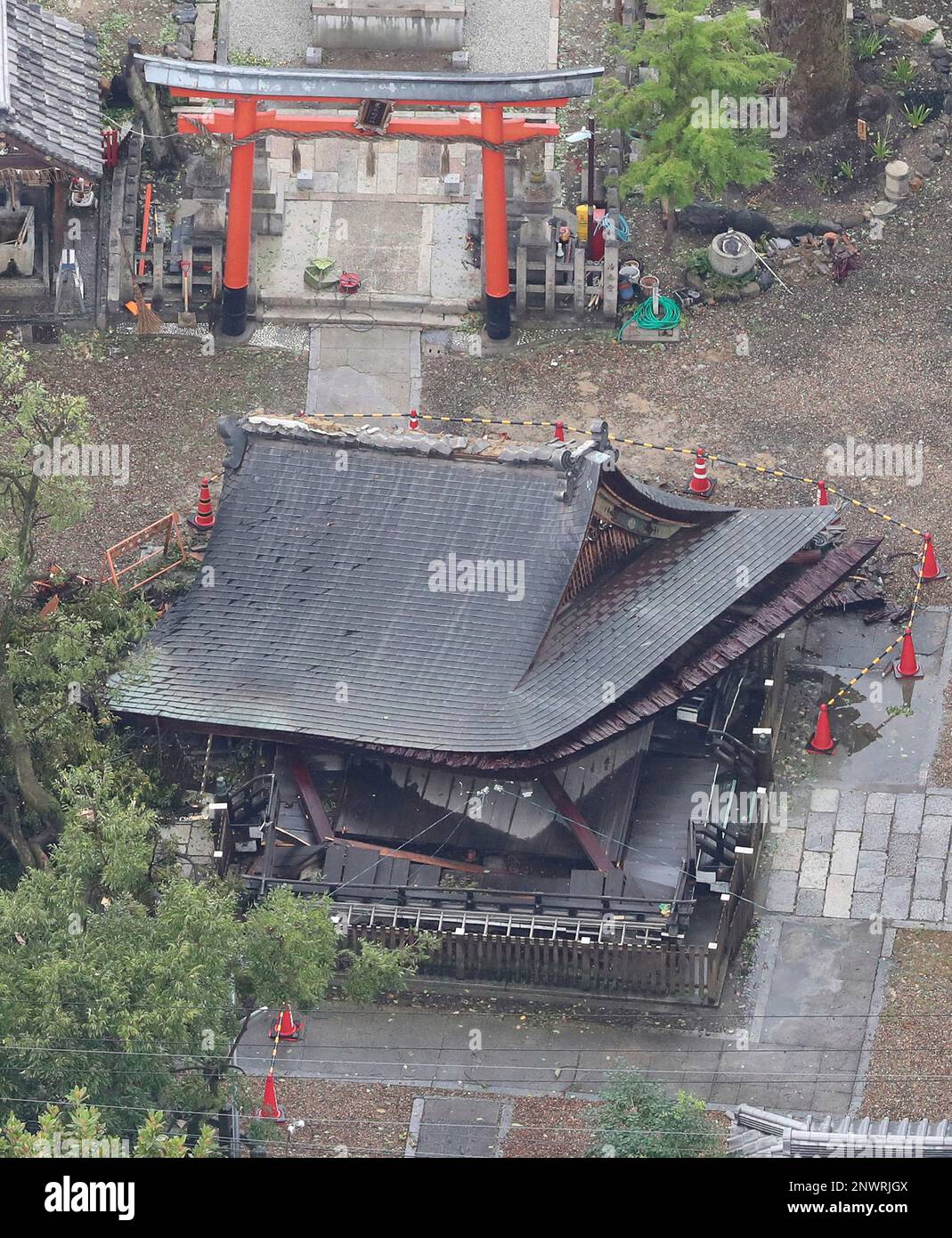 An aerial photo shows a shrine collapsed by the strong wind of the ...