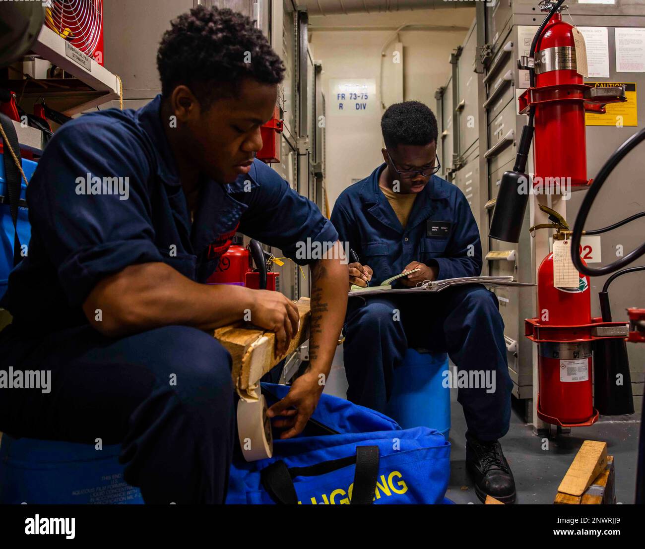 230104-N-XK047-1002 Fireman Jermaine Washington, left, and Damage ...