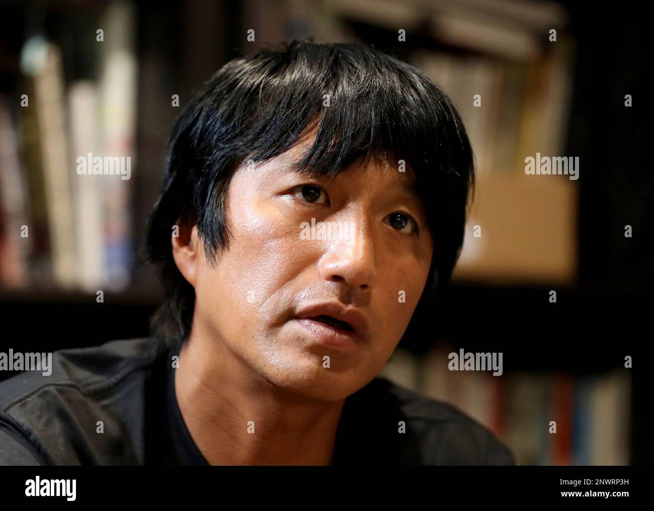 Yasuhiro Mihara, designer of Japanese fashion brand MIHARAYASUHIRO speaks during an interview at ...