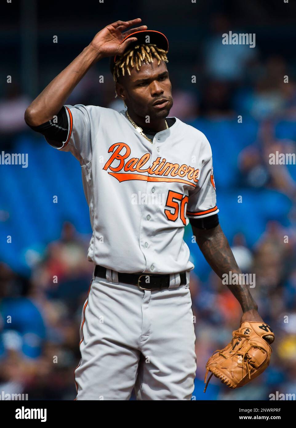 Baltimore Orioles relief pitcher Miguel Castro (50) reacts after giving ...