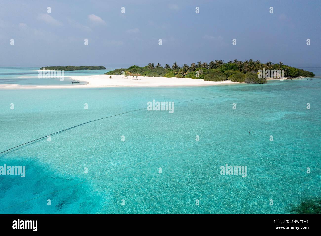 Aerial view: lonely Island with a sandbank and Palmtrees in the ...