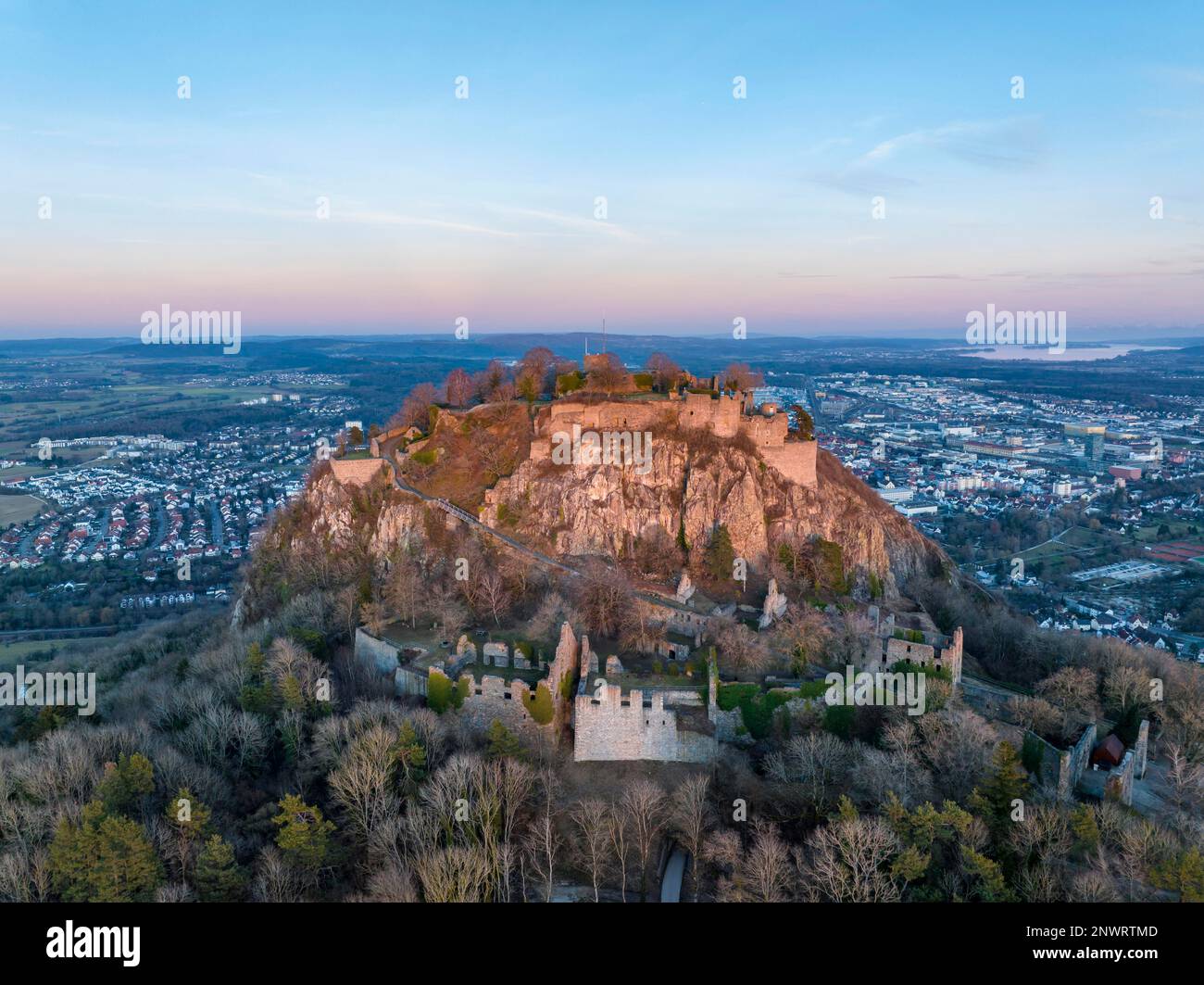 The volcanic cone Hohentwiel with the castle ruins illuminated by the ...