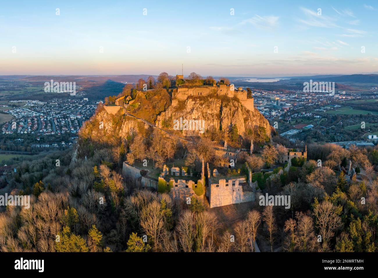 The volcanic cone Hohentwiel with the castle ruins illuminated by the ...