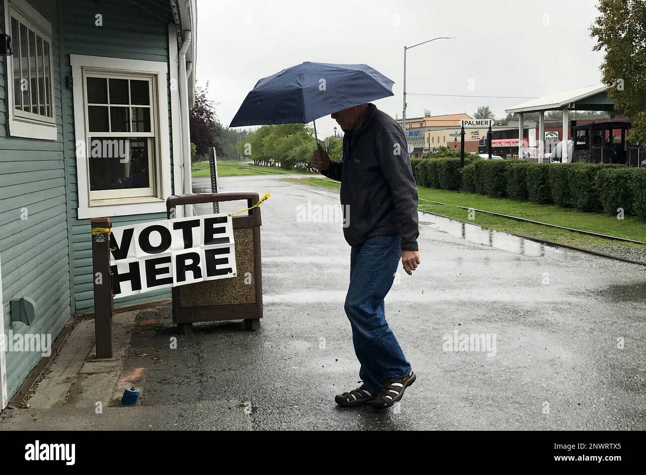 A voter enters the Palmer Community Center to cast their ballot in ...