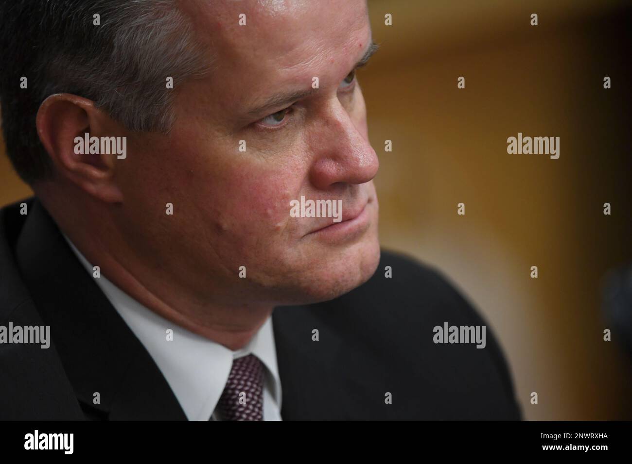 Michael J. Rourke, District Attorney for Weld County, listens to the ...