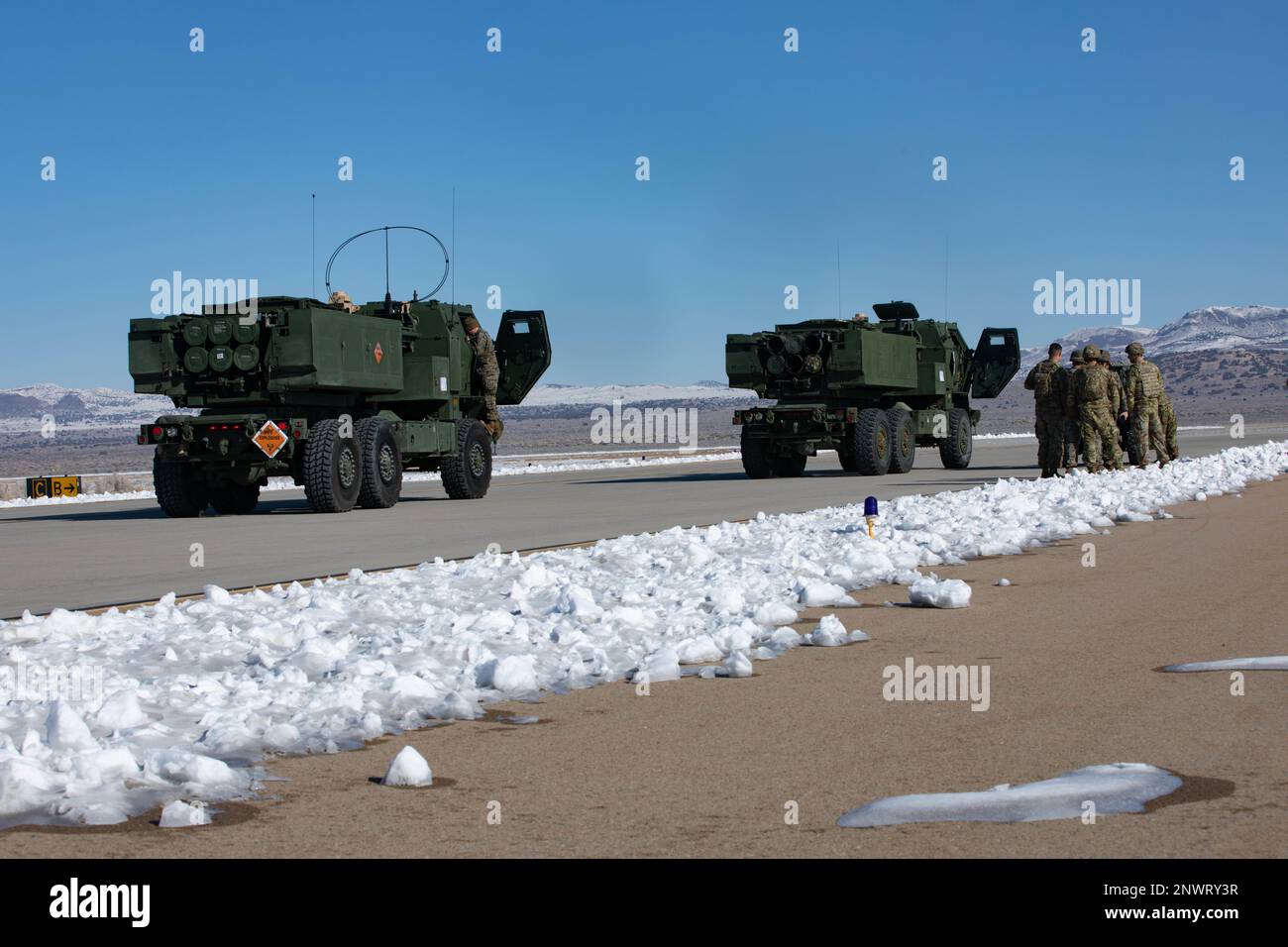 Two HIMARS are staged for a live-fire exercise in Utah Feb.2,2023. This ...