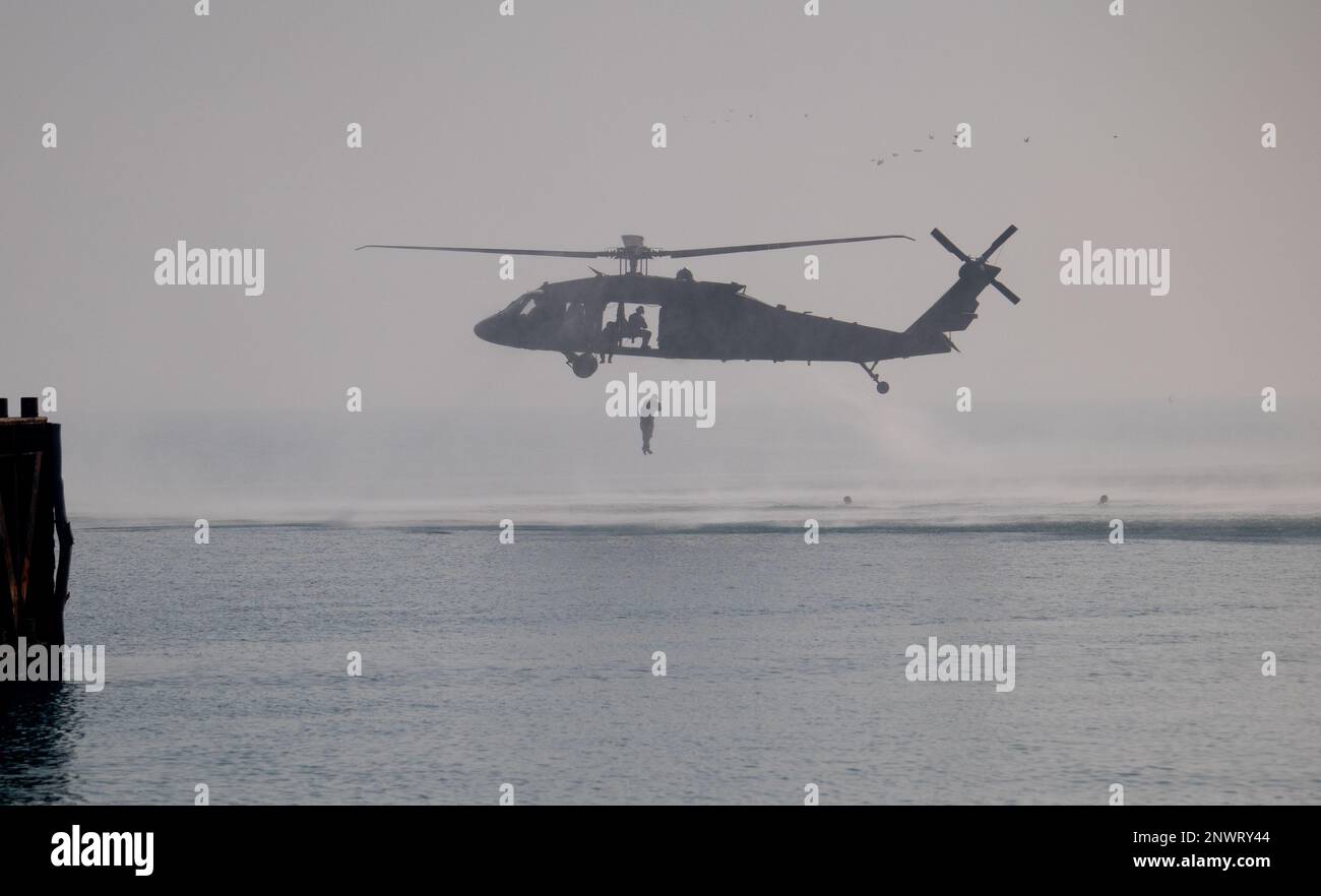 U.S. Army Soldier with the 511th Engineer Dive Detachment jumps into ...