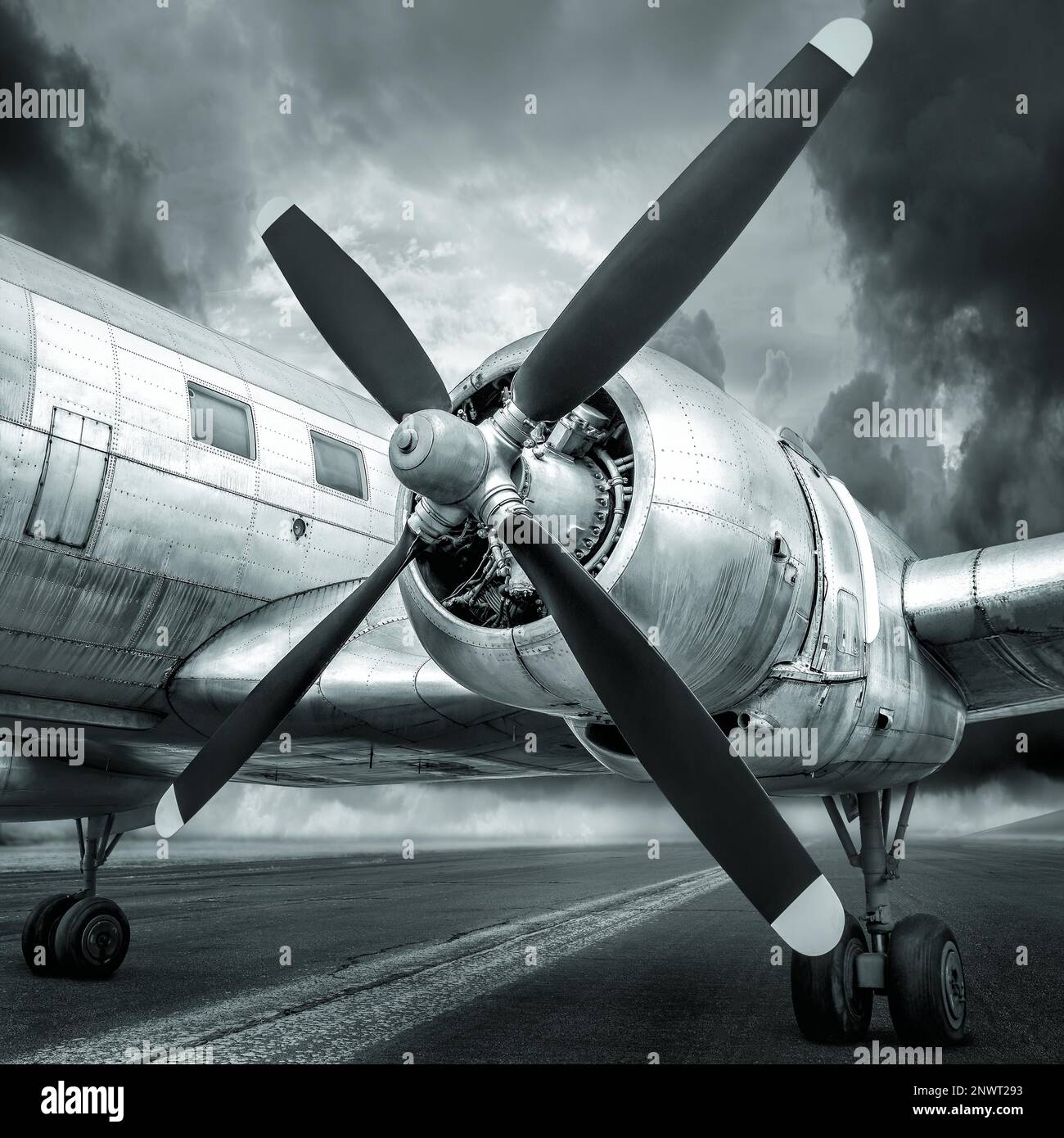 historic aircraft on a runway against a dramatic sky Stock Photo - Alamy