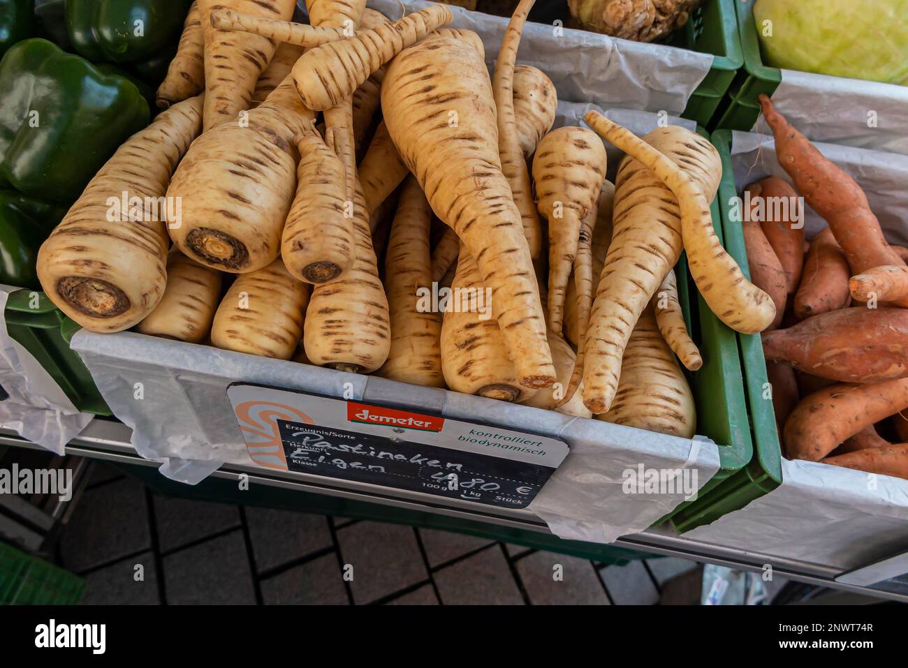 Root vegetable parsnip, display at the weekly market market in ...