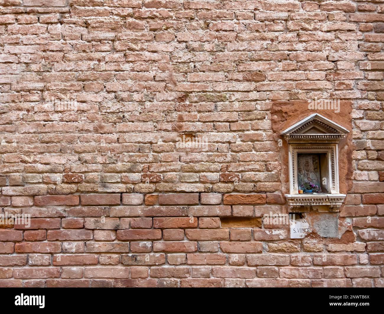 Religious niche in traditional brick textured wall background in design ...