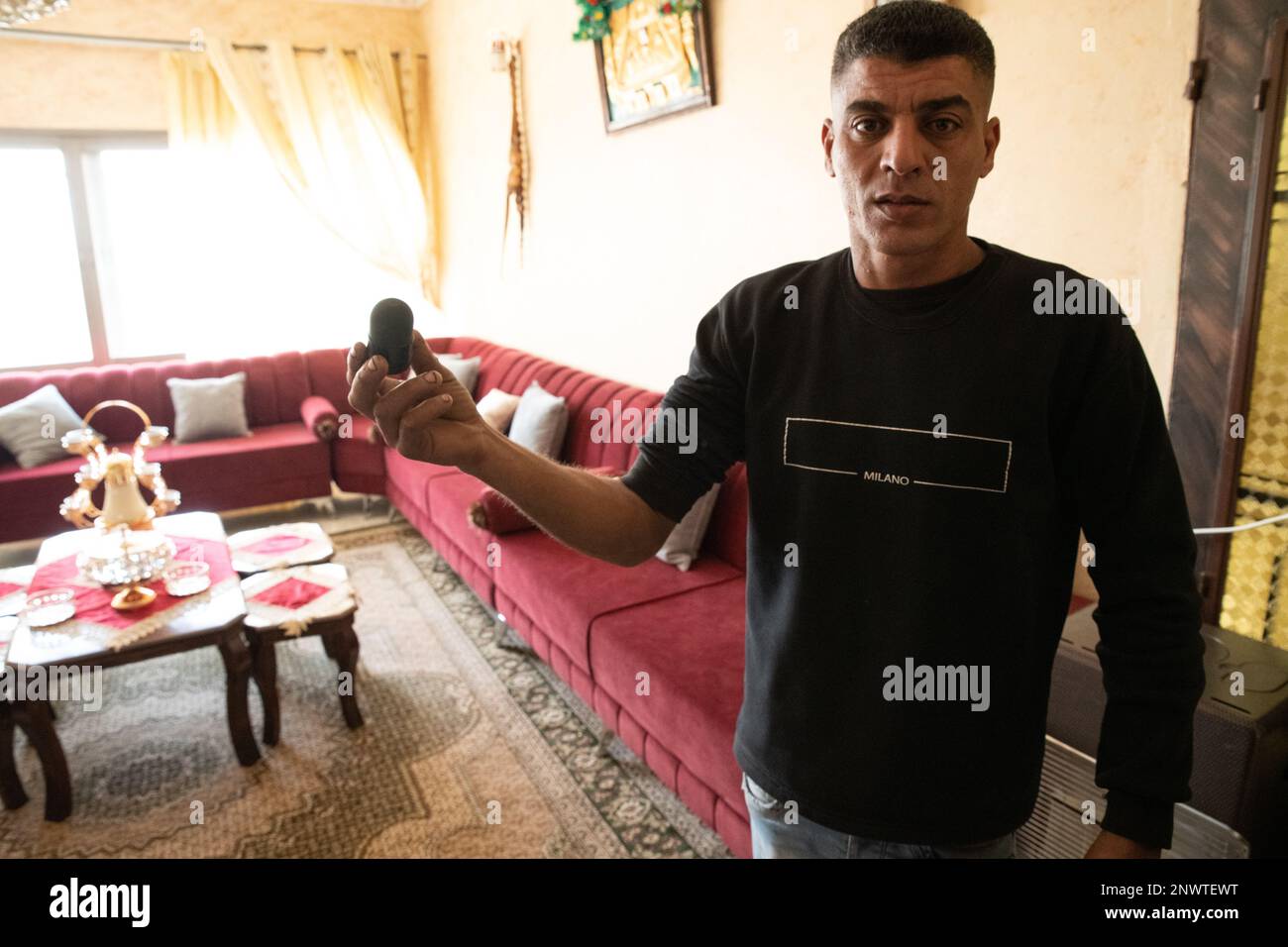 A Palestinian man presents the rubber bullet fired at him by IDF ...