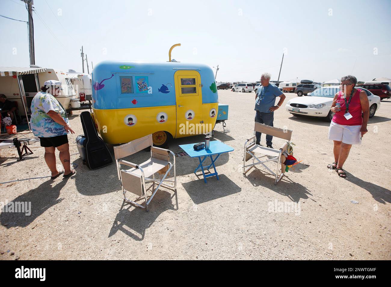 People come to visit Angela Durand as she sets up her Yellow Submarine ...