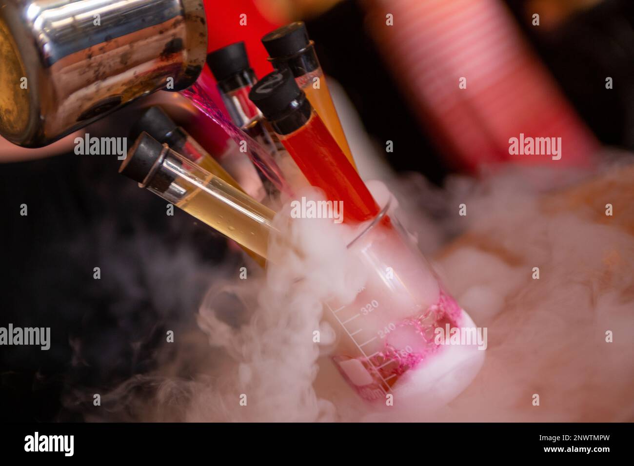 Science experiment with fire on dry ice Stock Photo - Alamy