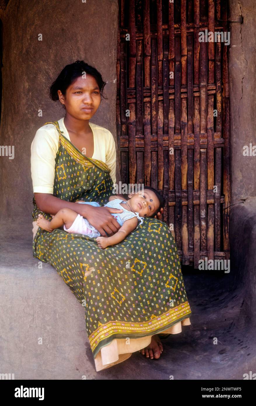 Jenu Kurumba tribal woman with her baby at Nagarhole, Karnataka, South ...