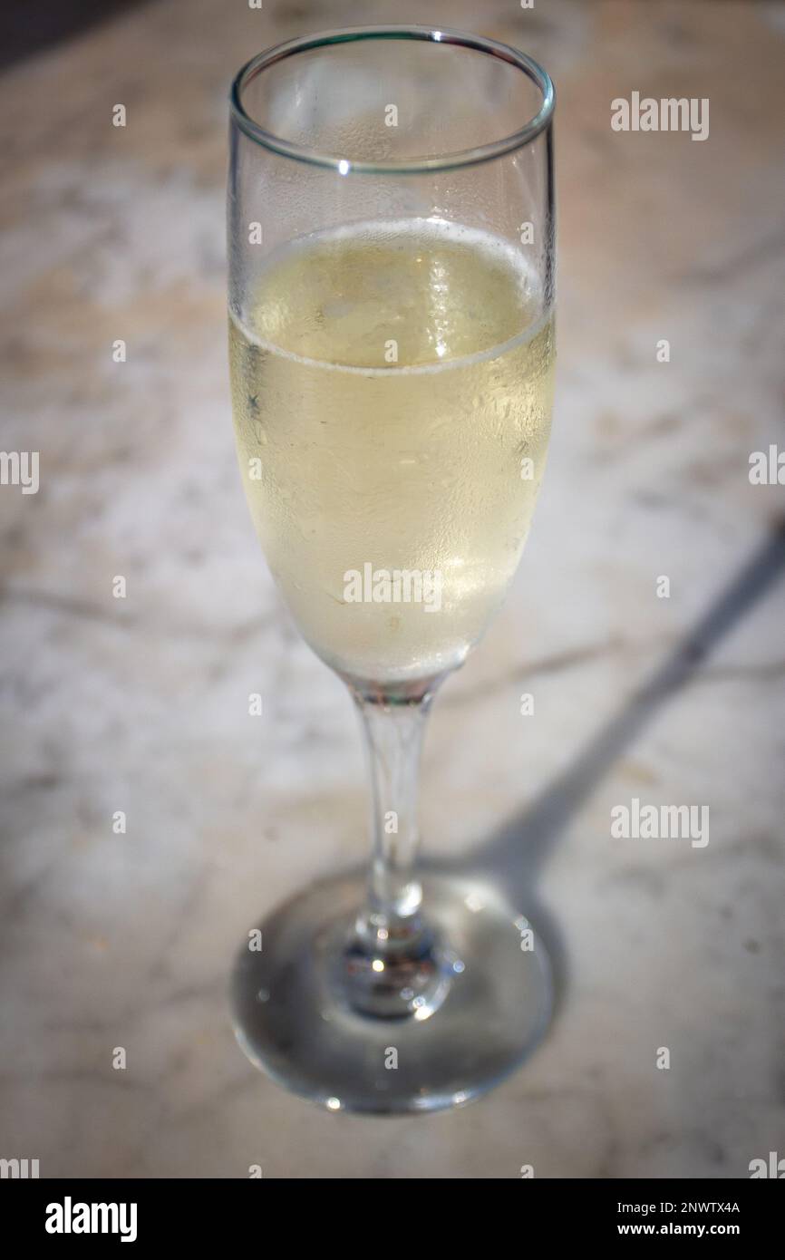 Glass of champagne bubbling Stock Photo - Alamy