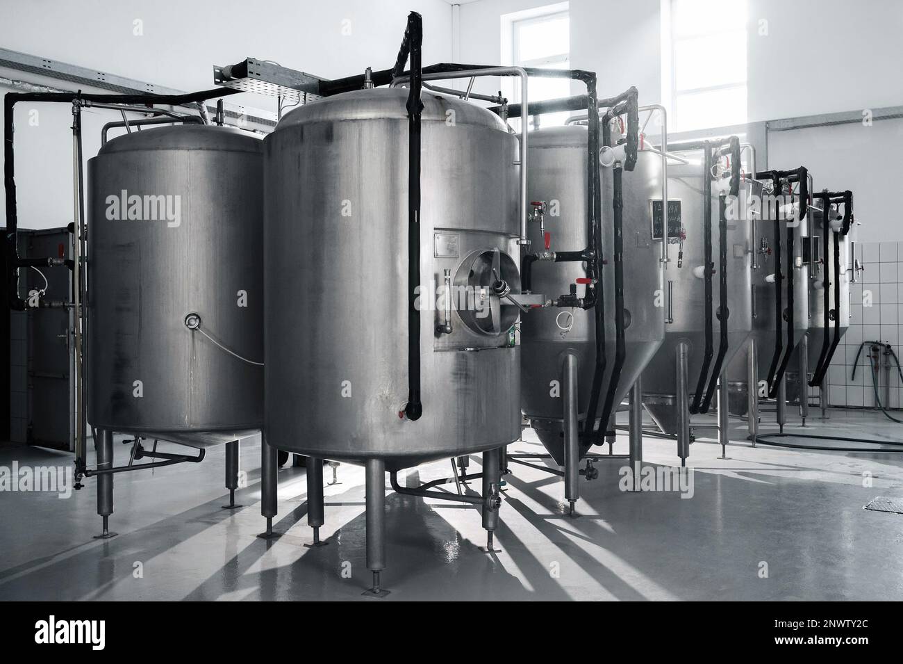 interior of a modern factory brewery with tanks inside Stock Photo - Alamy