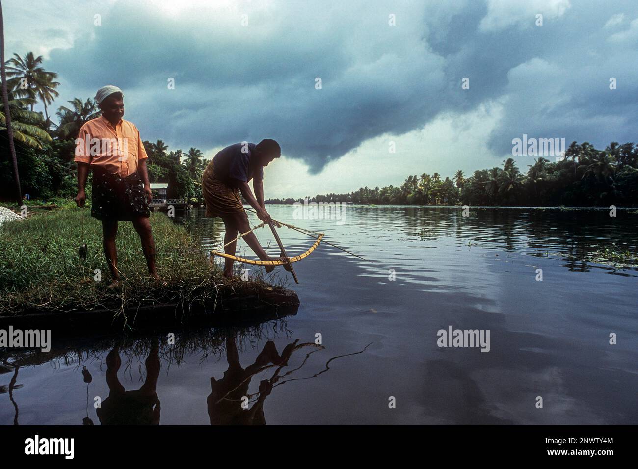 Fishing with bow and Arrow, the traditional way, Backwaters of Kuttanad ...