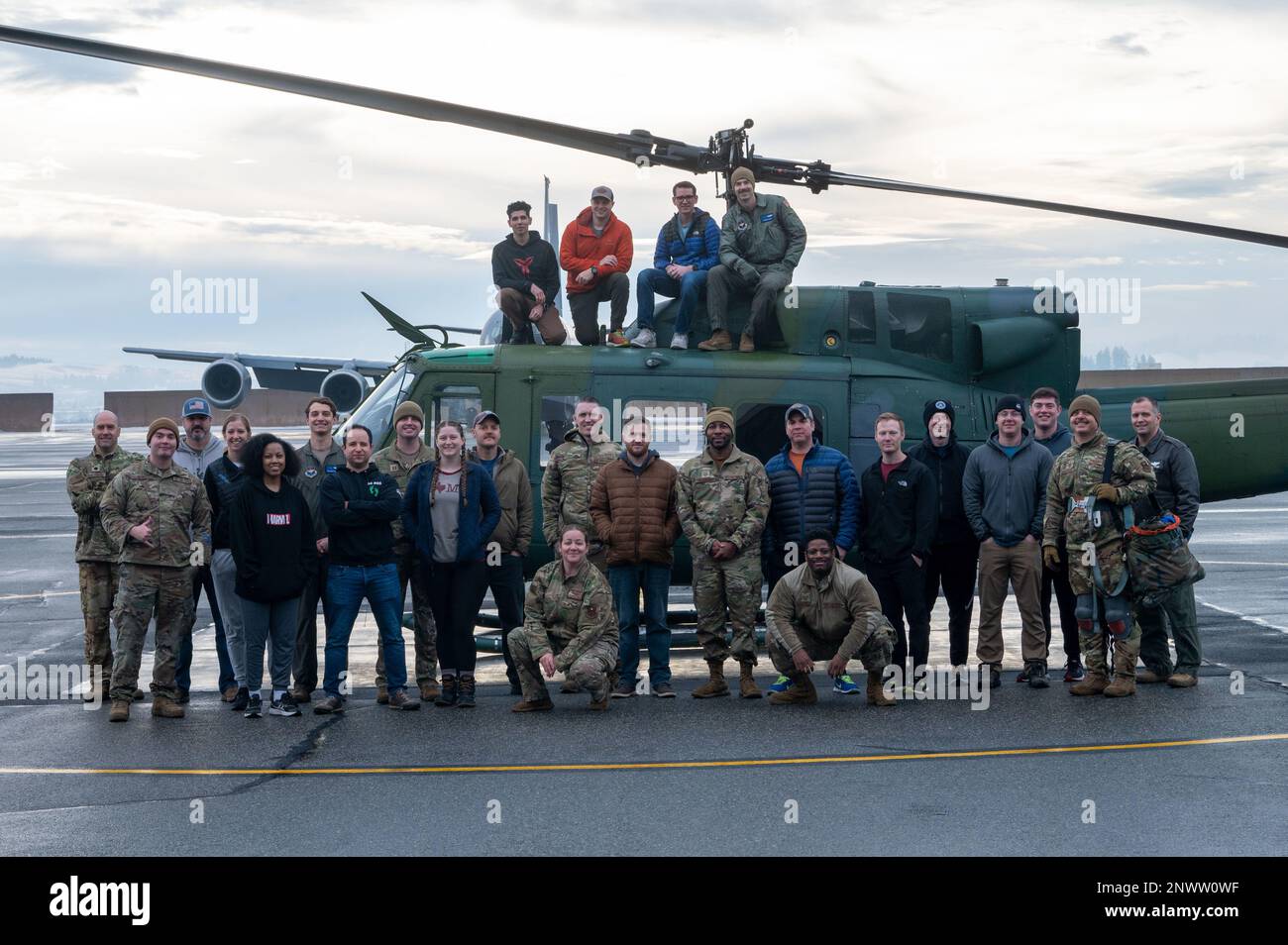 U.S. Air Force Airmen and civilians from the 36th Rescue Squadron pose ...