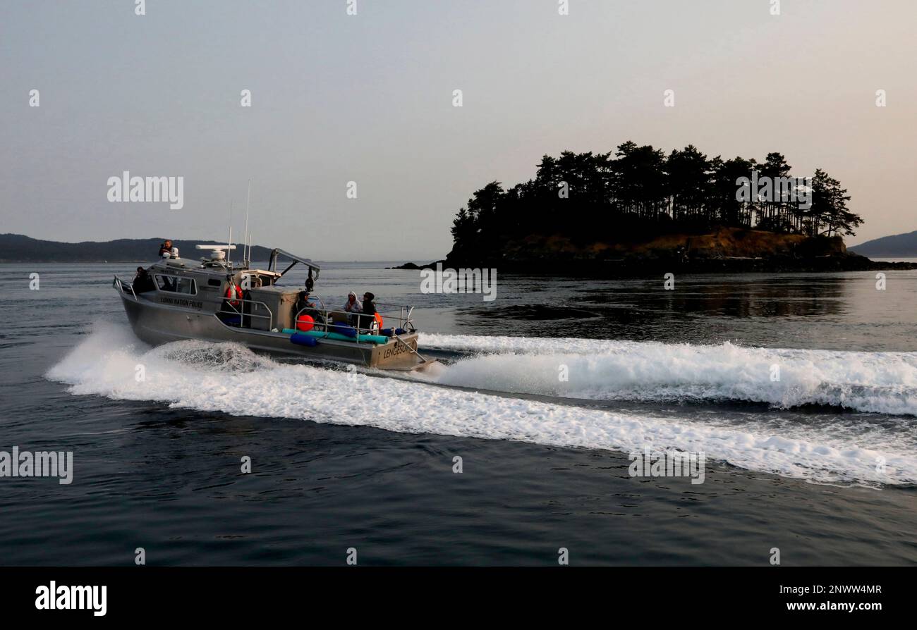 The Lummi police boat heads to the west side of San Juan Island in an ...