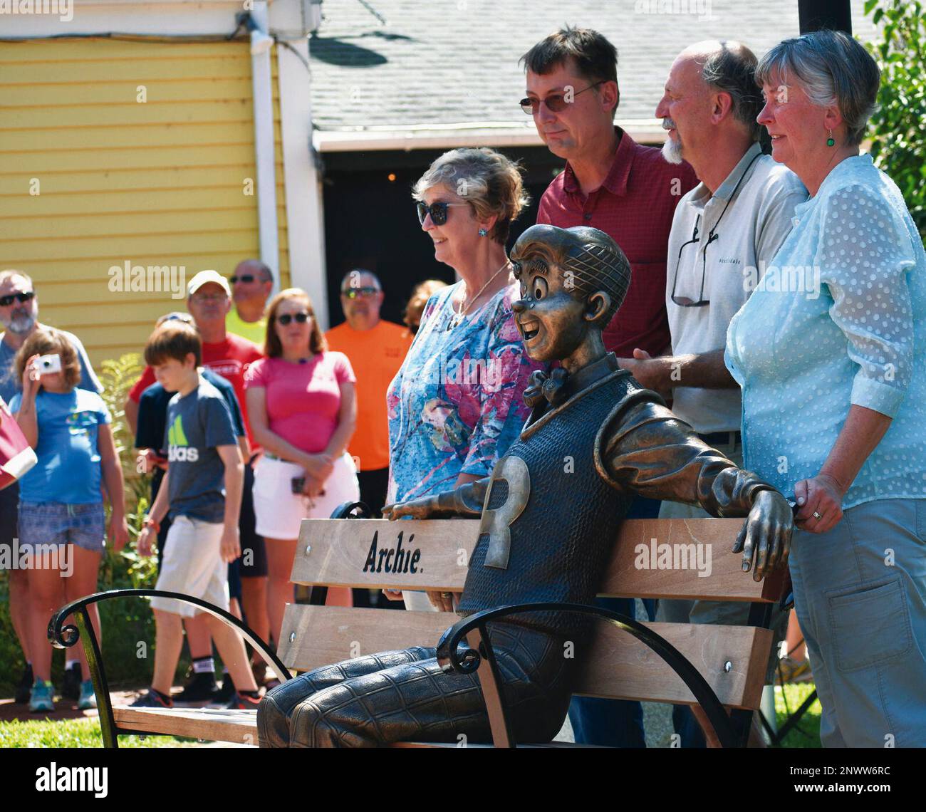 A statue of the comic strip character Archie sits on a park bench ...