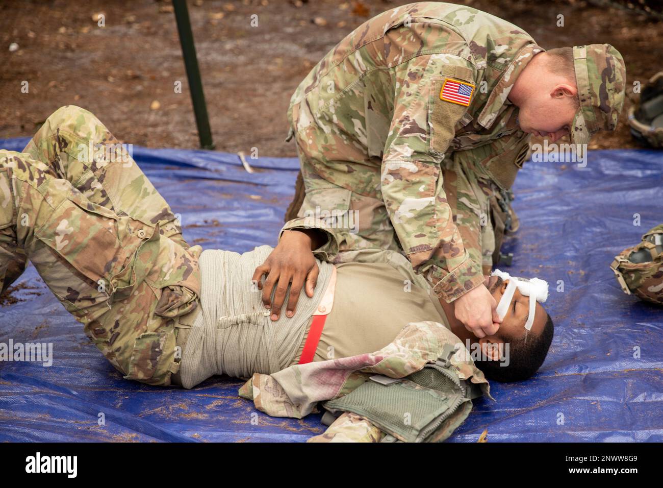 Soldiers from the 3rd Infantry Division learn to treat a head wound in ...