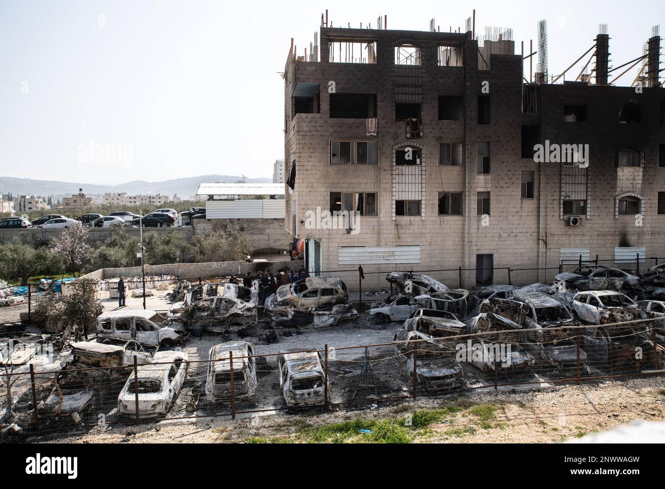 Hawara, Palestine. 28th Feb, 2023. Burned cars and sooted Palestinian ...