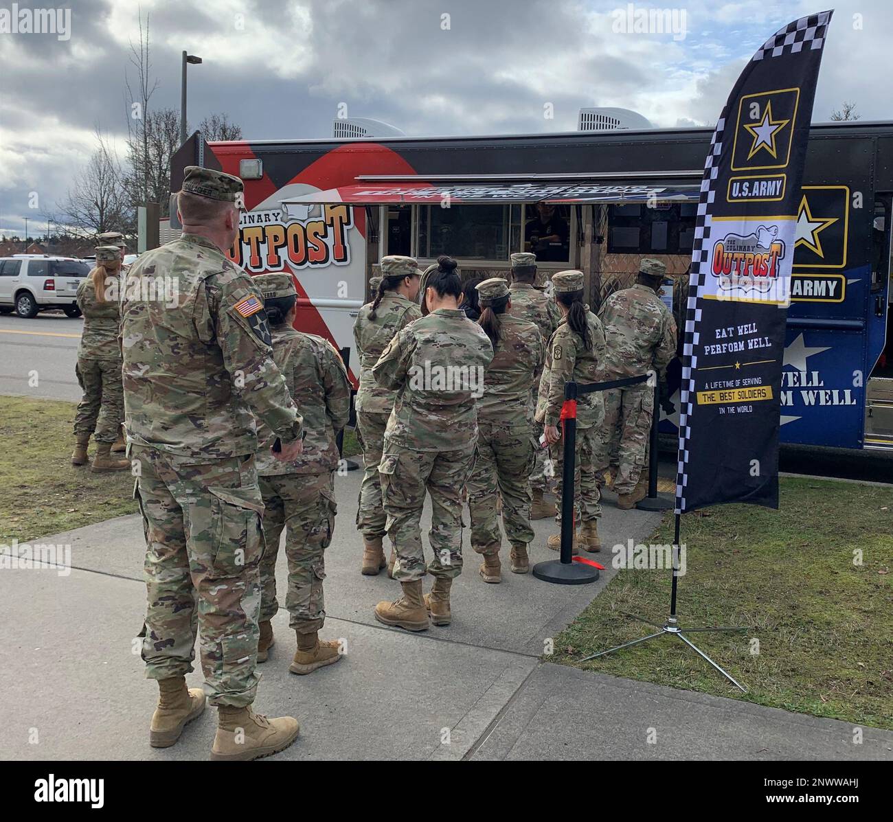 Service members line up to order their meals from the newly operational ...