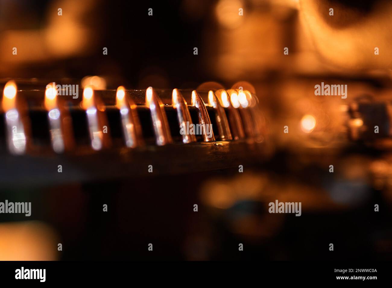Copper bullets on production line part at weapon factory Stock Photo ...
