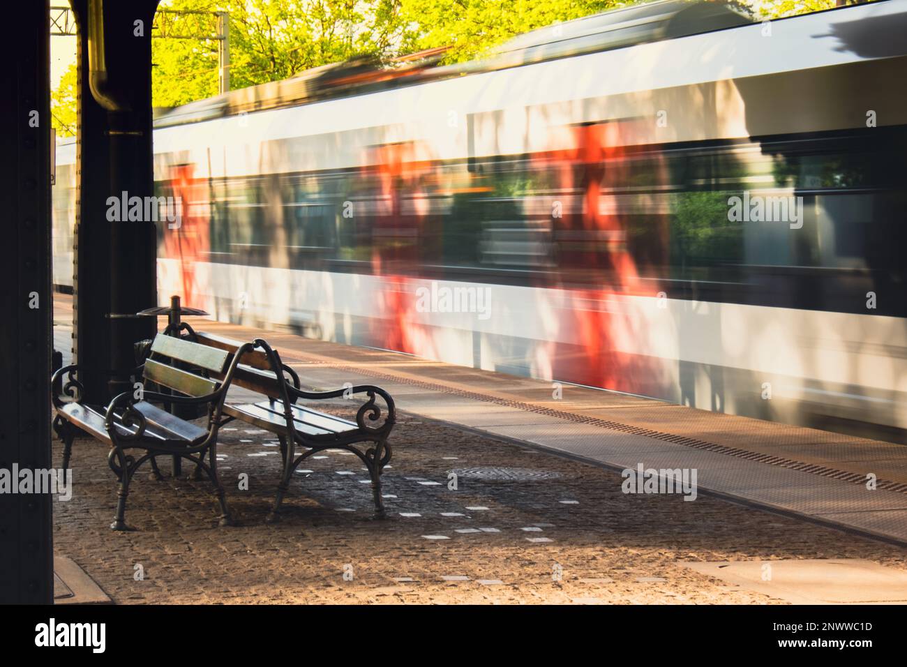 Railway station with empty bench. The way forward railway for train ...