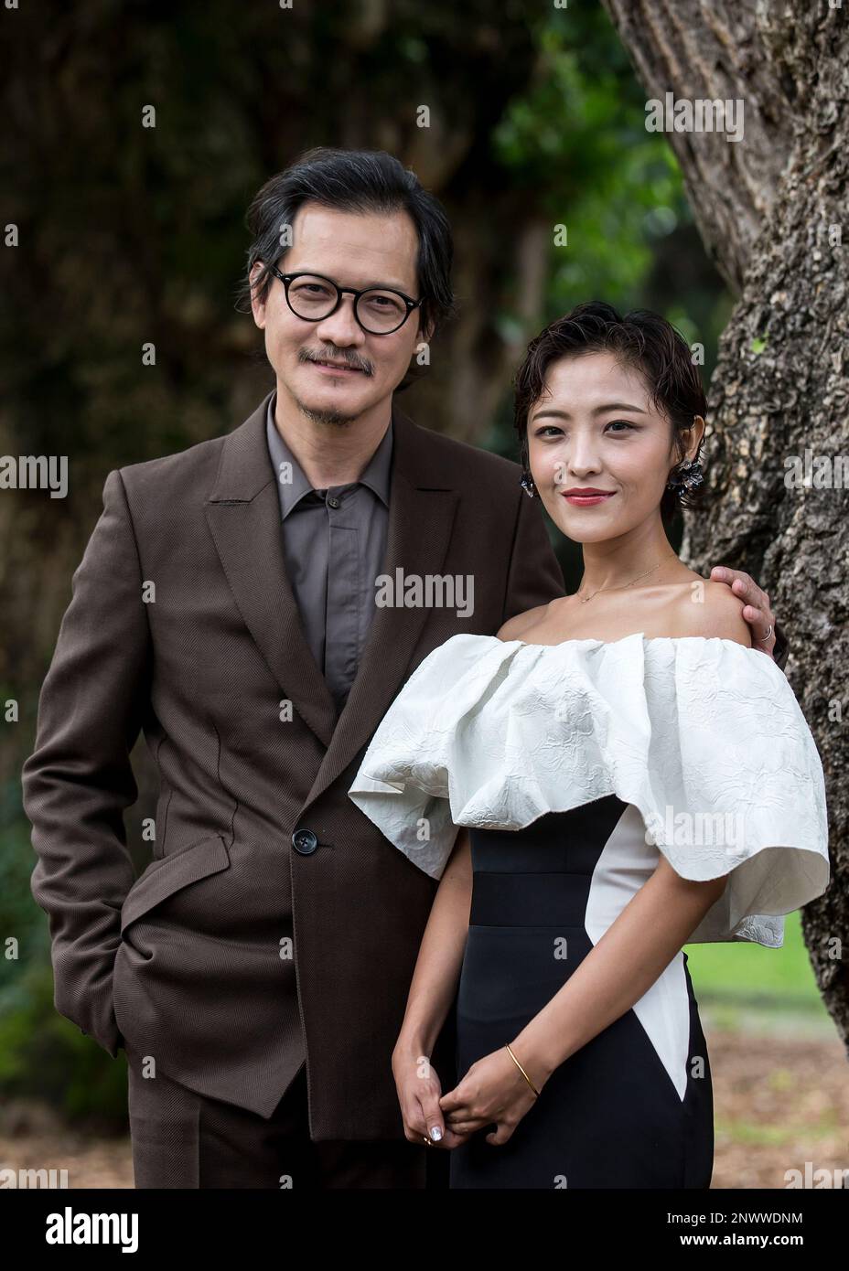 Singaporean actor Peter Yu and Chinese actress Luna Kwok, from left, pose during a photocall for ...