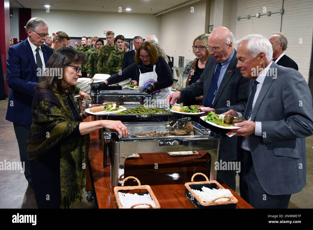 Guests from both Minnesota and Norway enjoy a meal provided by the ...