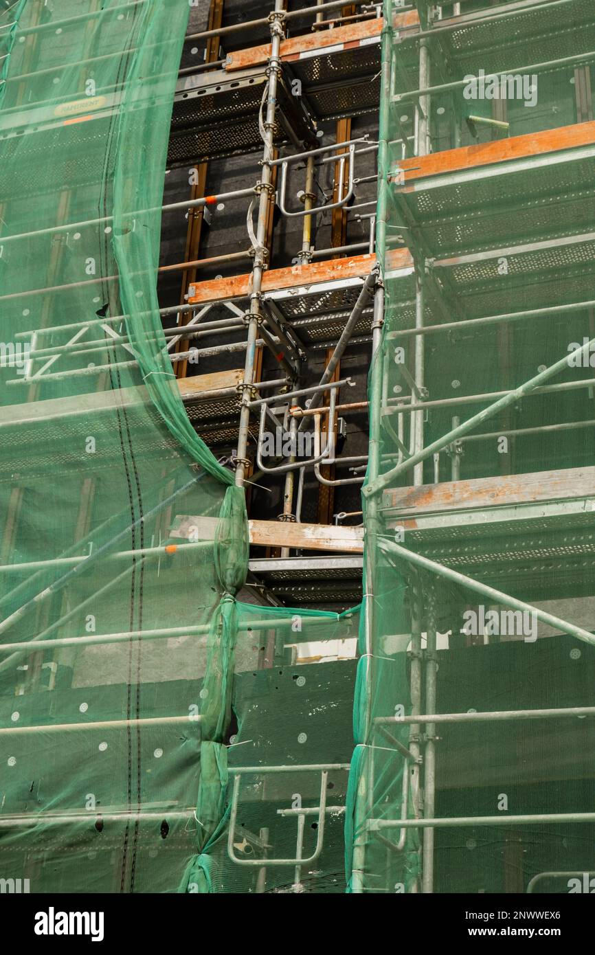 Construction site with unfinished residential building outdoors covered ...