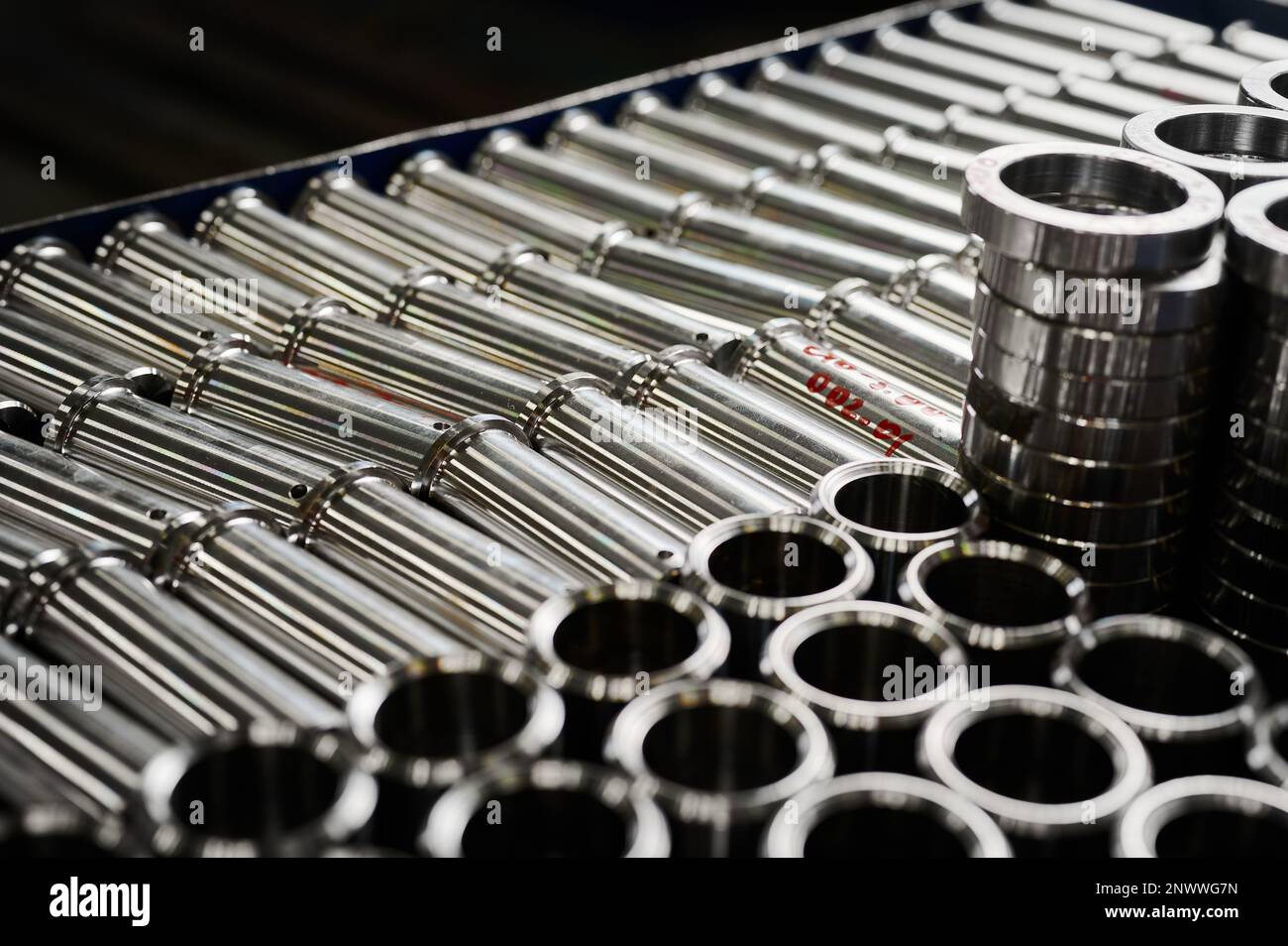 Steel rings and cylinders made with automated machines Stock Photo - Alamy
