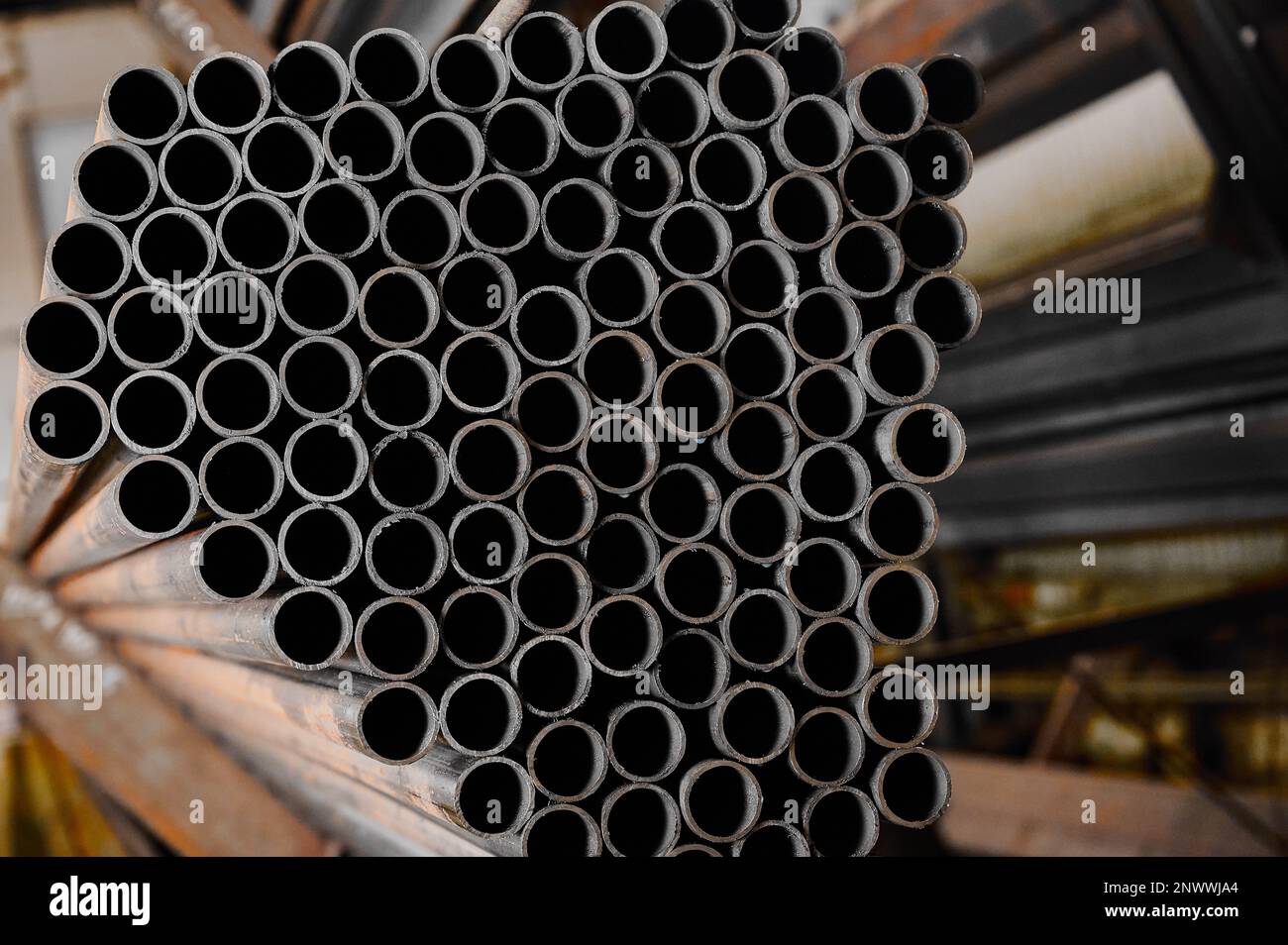 Stack of rusty cold rolled tubes in industrial complex storage Stock ...