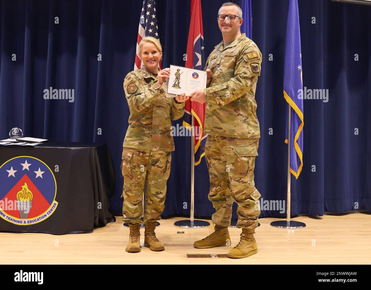U.S. Air Force Tech Sgt. David Hartman receives the TEC & ANGRC NCO ...