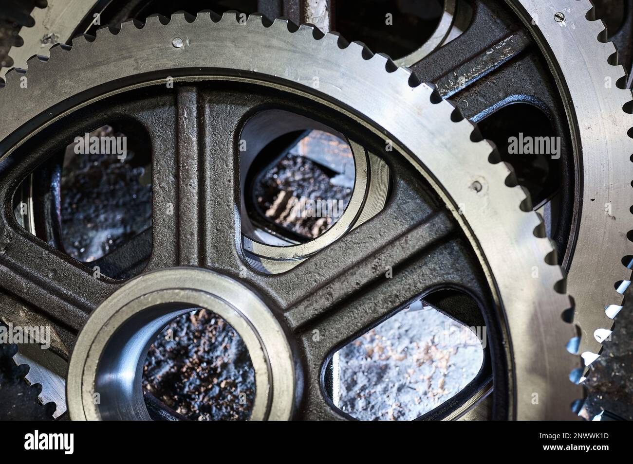 Pile of metal cogwheels for spiral gear drive in warehouse Stock Photo ...