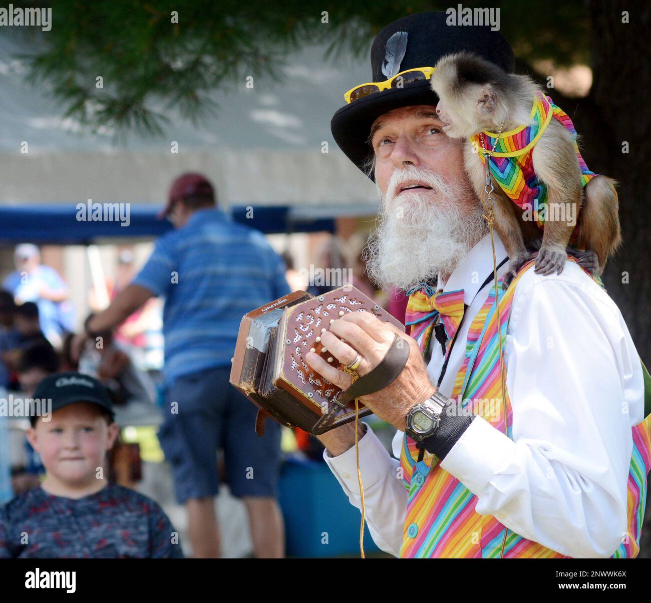 Jerry Brown, of Lancaster, Pa., and his monkey entertain during the ...