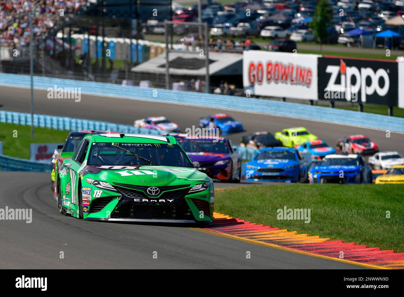 Kyle Busch (18) leads the field during the Monster Energy NASCAR Cup ...