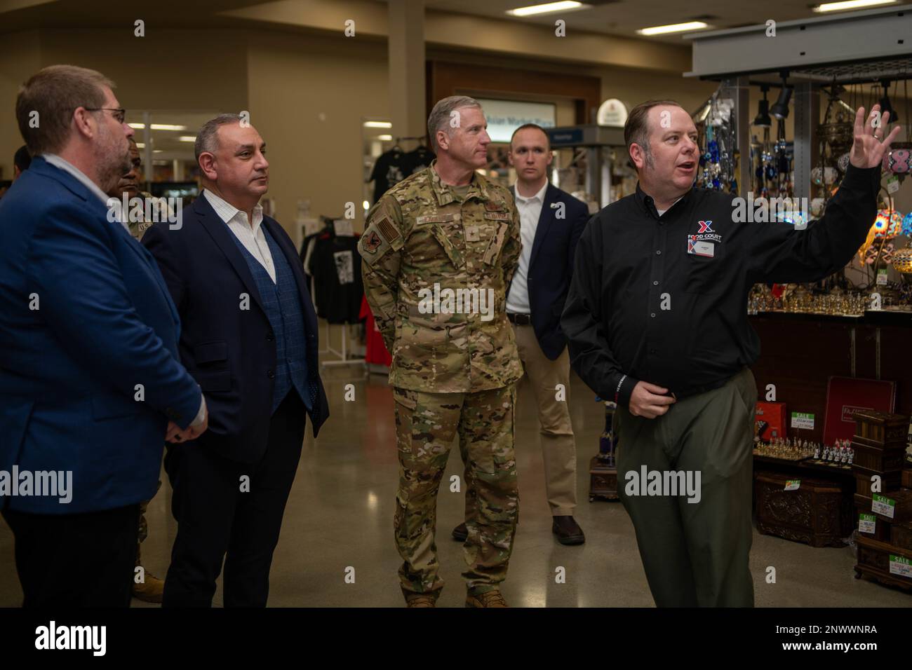 Andrew Nims, right, Kadena Food Court manager, briefs the Honorable ...