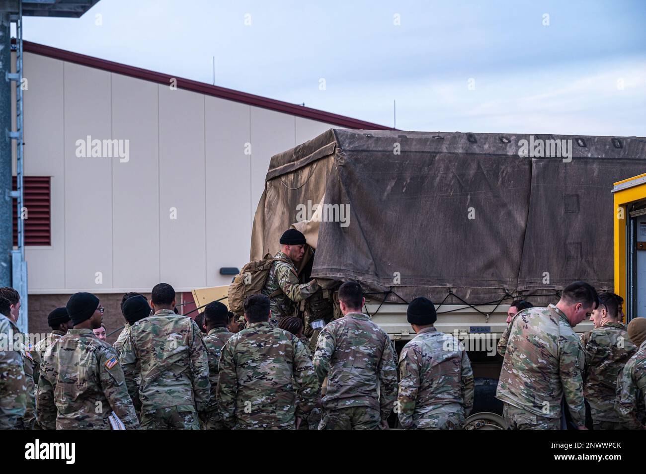 Soldiers from the 422nd Civil Affairs Battalion load their equipment ...