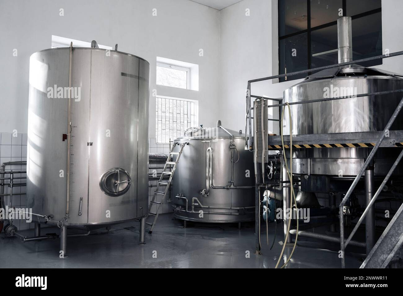 interior of a modern factory brewery with tanks inside Stock Photo - Alamy